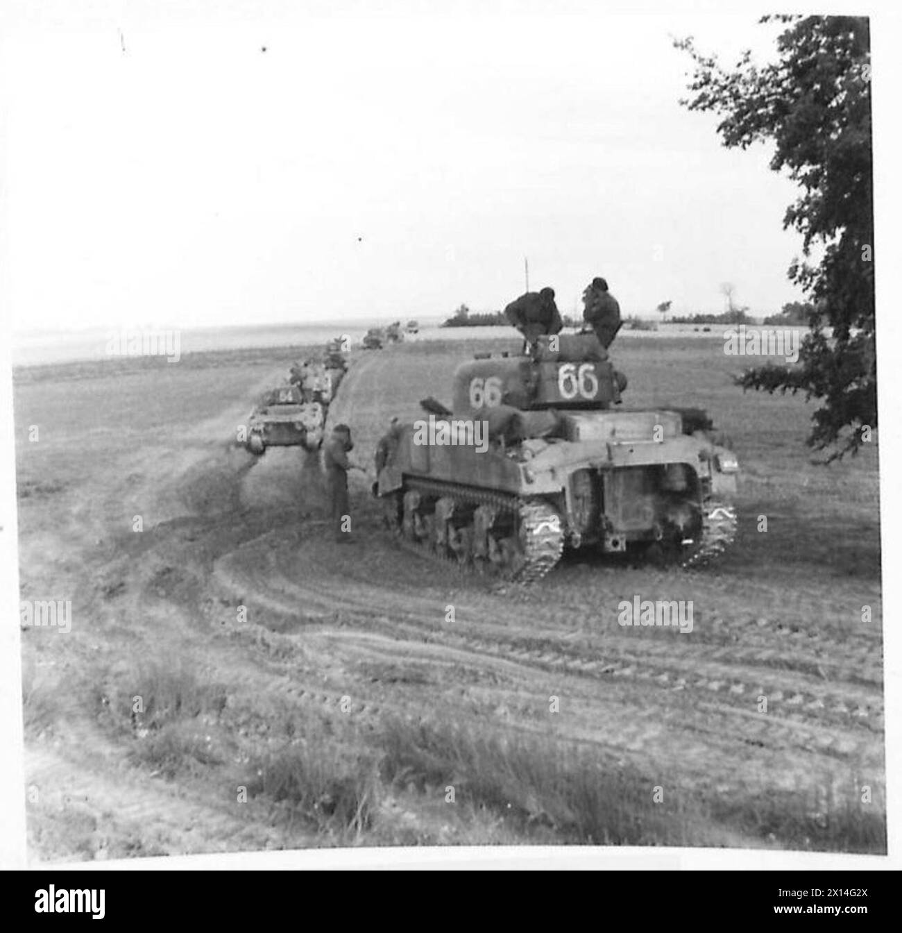 THE ATTACK ON CAEN - British Sherman tanks of A/T Brigade, 33rd Armoured Brigade passing through ...