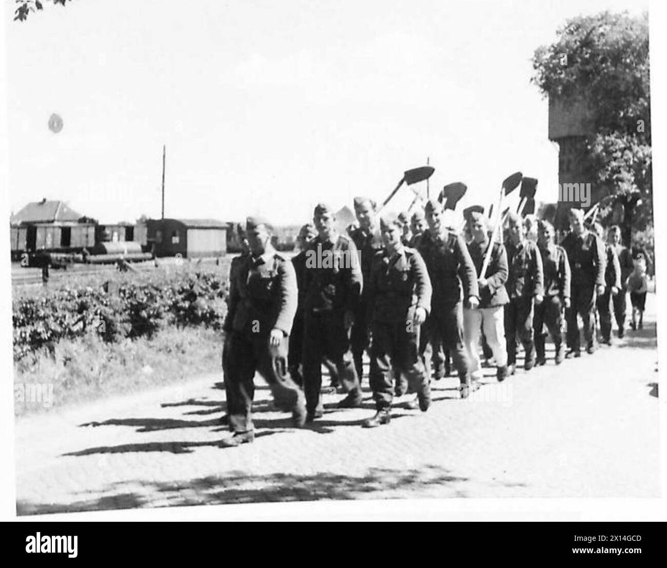 German prisoners of war perform labor by removing roadblocks and ...