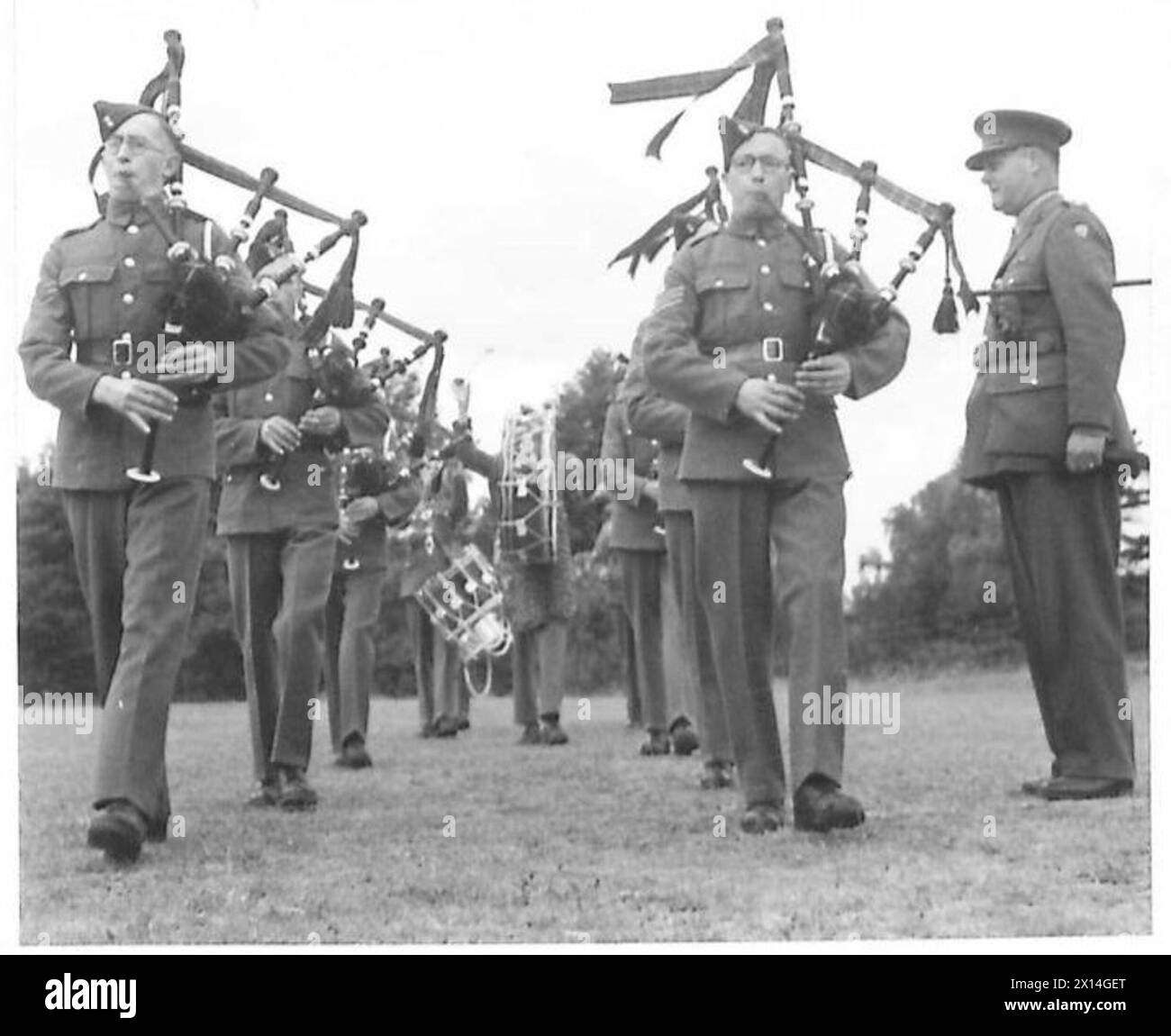 Members of the Pioneer Company Pipe Band of the British Army performing ...