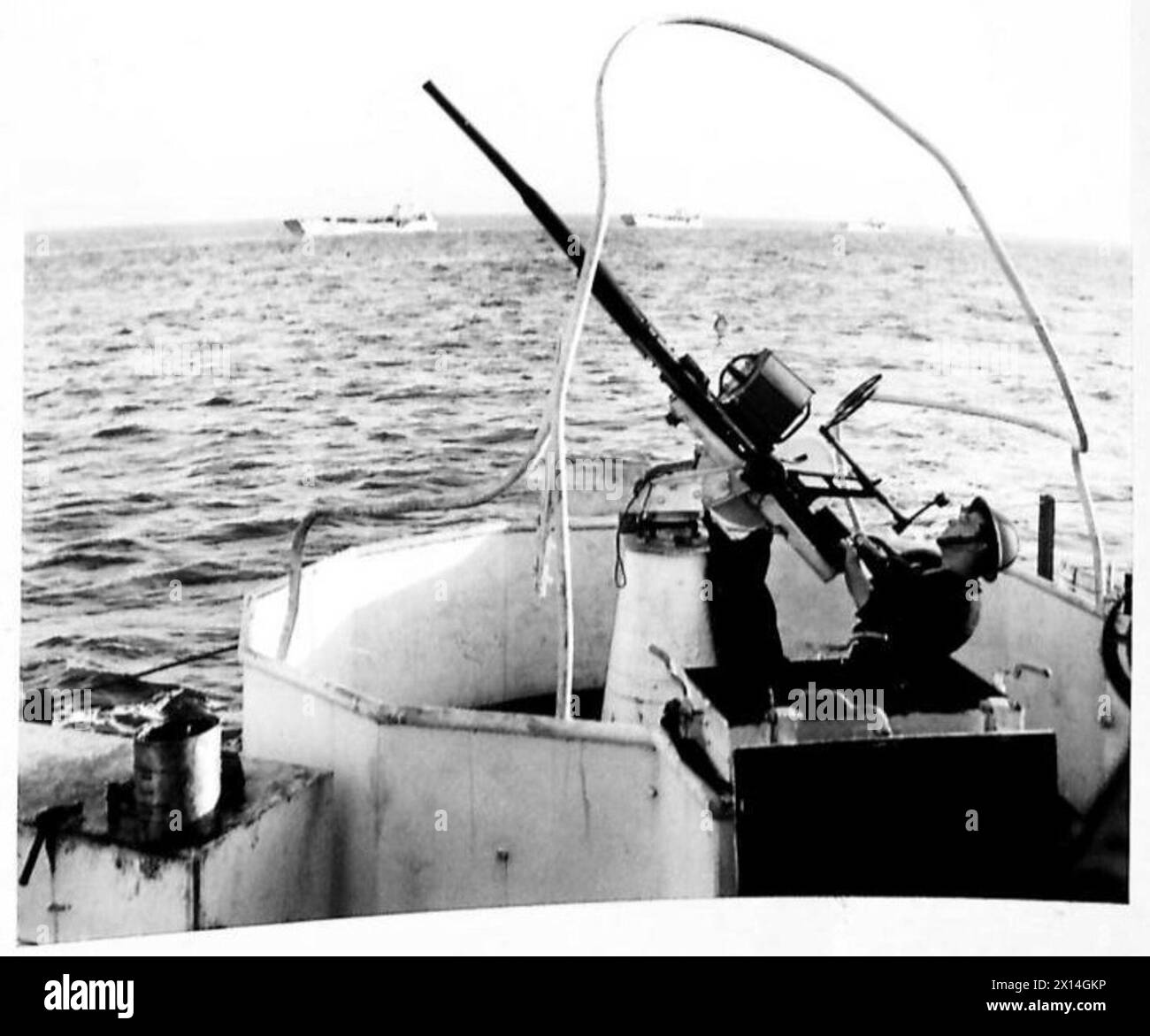 LARGE SCALE EXERCISE - A gunner stands by one of the guns a 20 mm ...