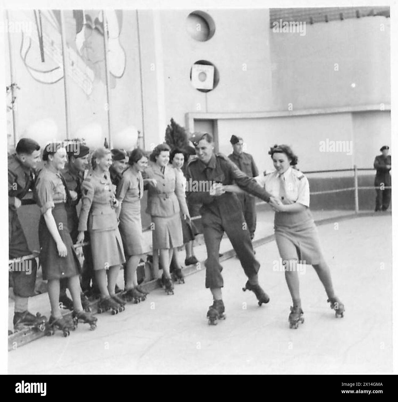 Soldiers on leave enjoy rolling skating, with an experienced pair ...