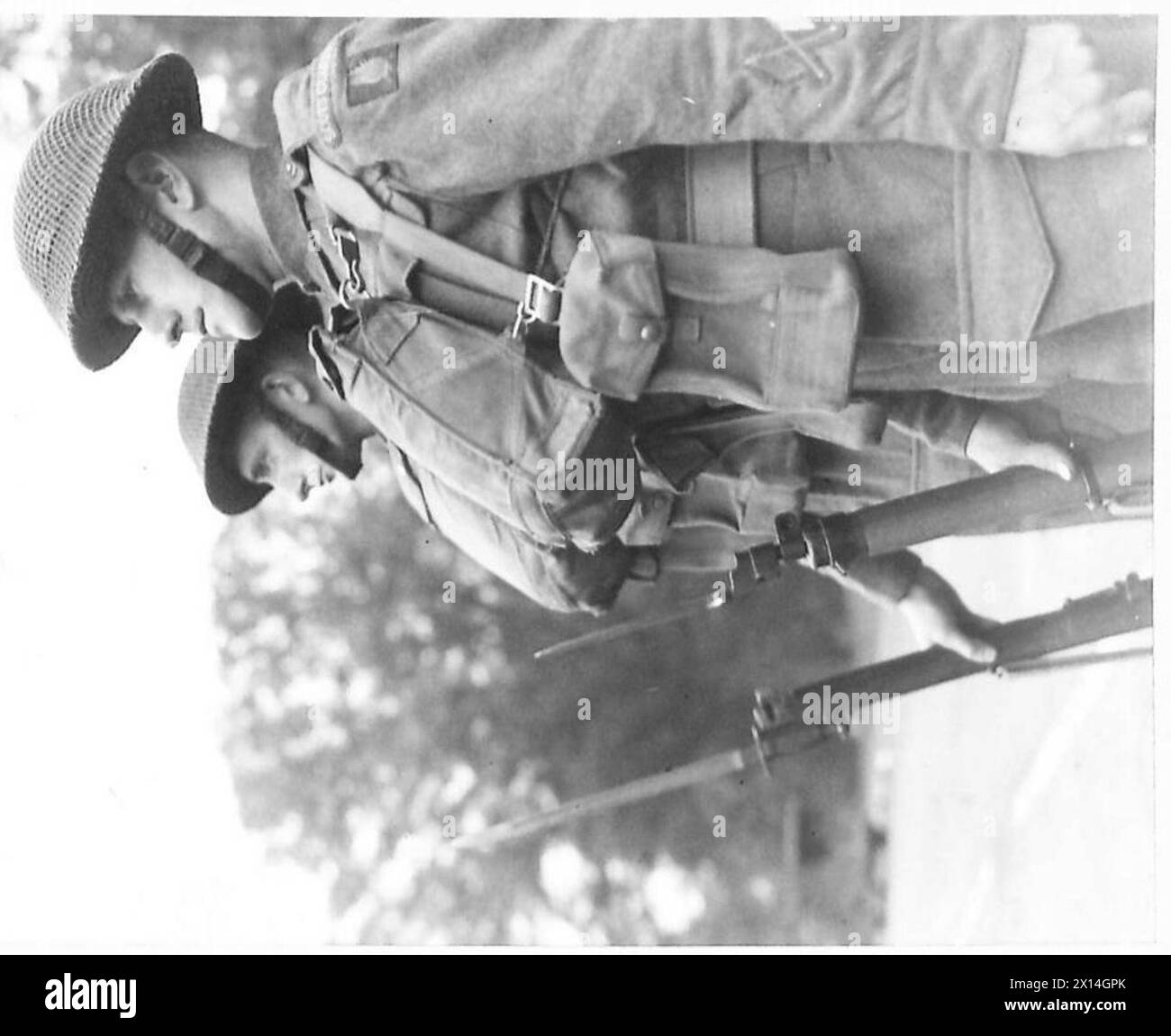 CONTRAST IN BAYONETS - A comparison picture of men of a battalion of ...