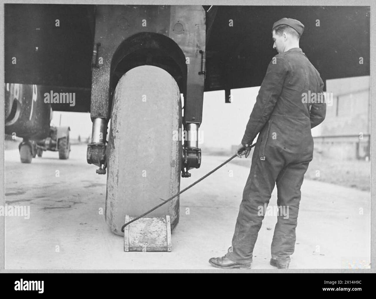 A HALIFAX & WHITLEY BOMBER STATION OF THE ROYAL AIR FORCE. - "Chocks ...