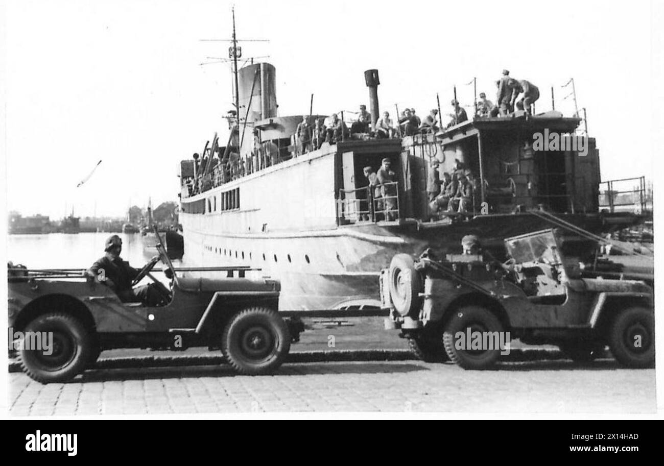 Two jeeps are stationed on the quayside in Bremerhaven before a boat ...