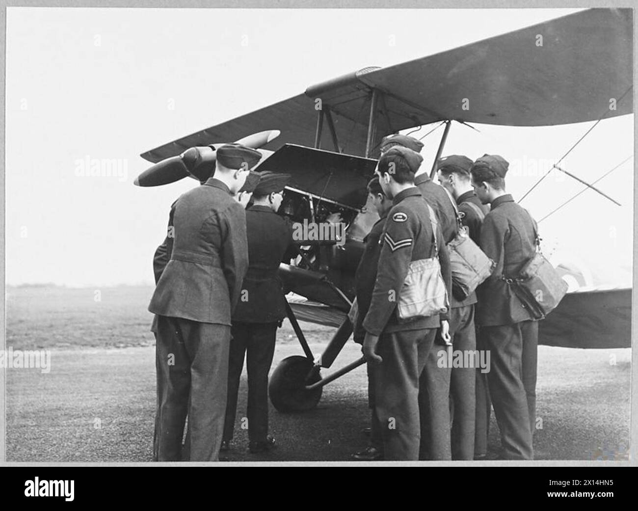 An RAF engine mechanic instructs Air Training Corps cadets on ...