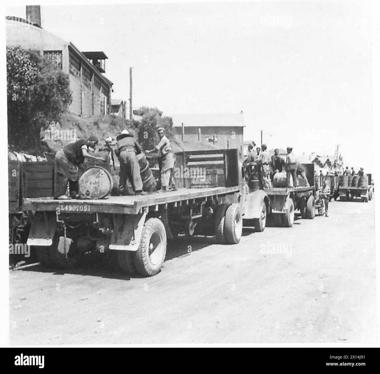 PETROL DEPOT - Loading barrels into rail trucks at railhead British ...
