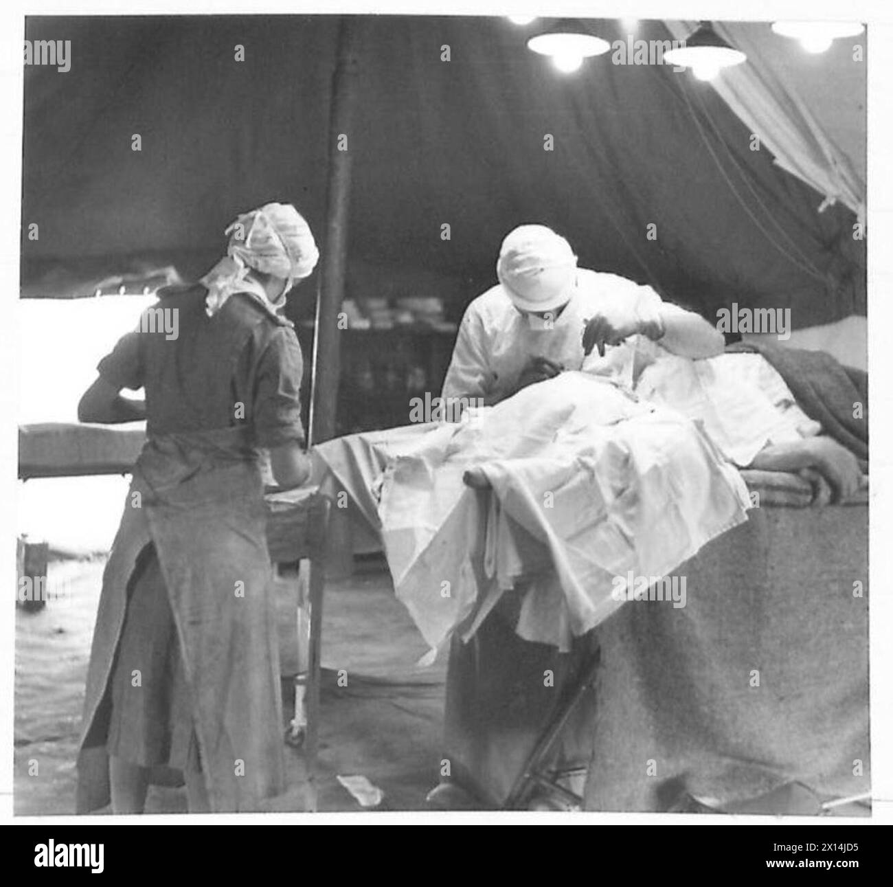WOMEN AT WAR - Sister M. Willis assisting the surgeon, Major A.I.S ...