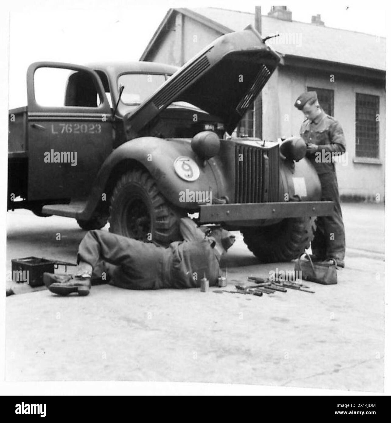 SKILLED MECHANICS AT WORK IN THE ARMY - A vehicle workshop inspection ...