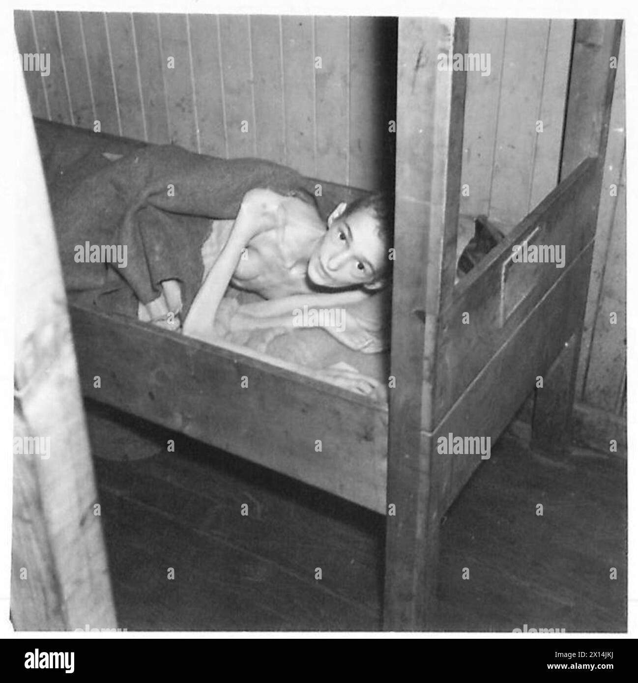 Photographs from Belsen Camp show the typhus hospital being cleaned and ...
