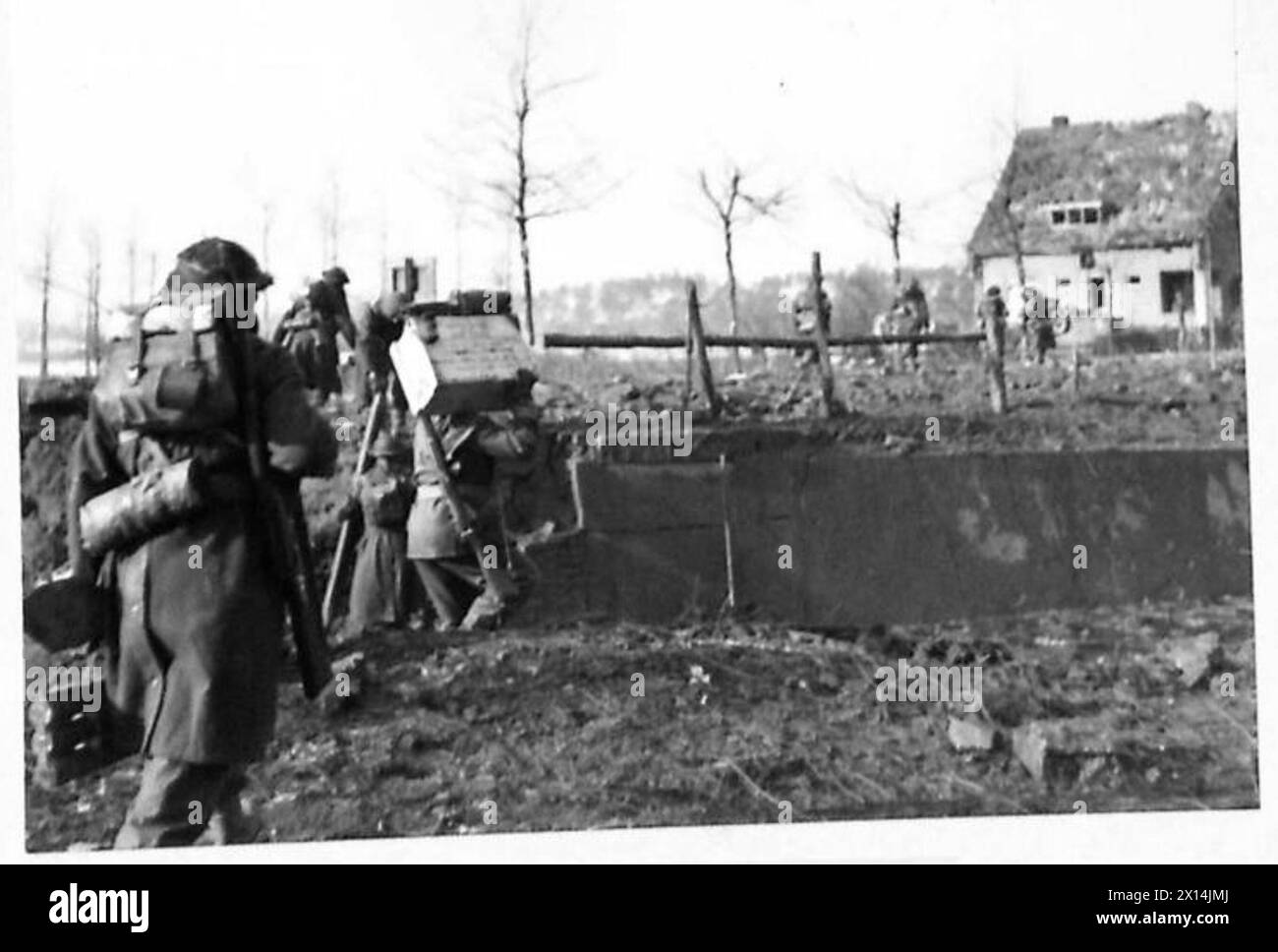 FALL OF MONTFORT - Troops advancing through Montfort, under enemy shell ...