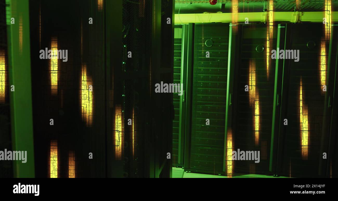 Glowing yellow lights and data processing over green lit, dark computer ...