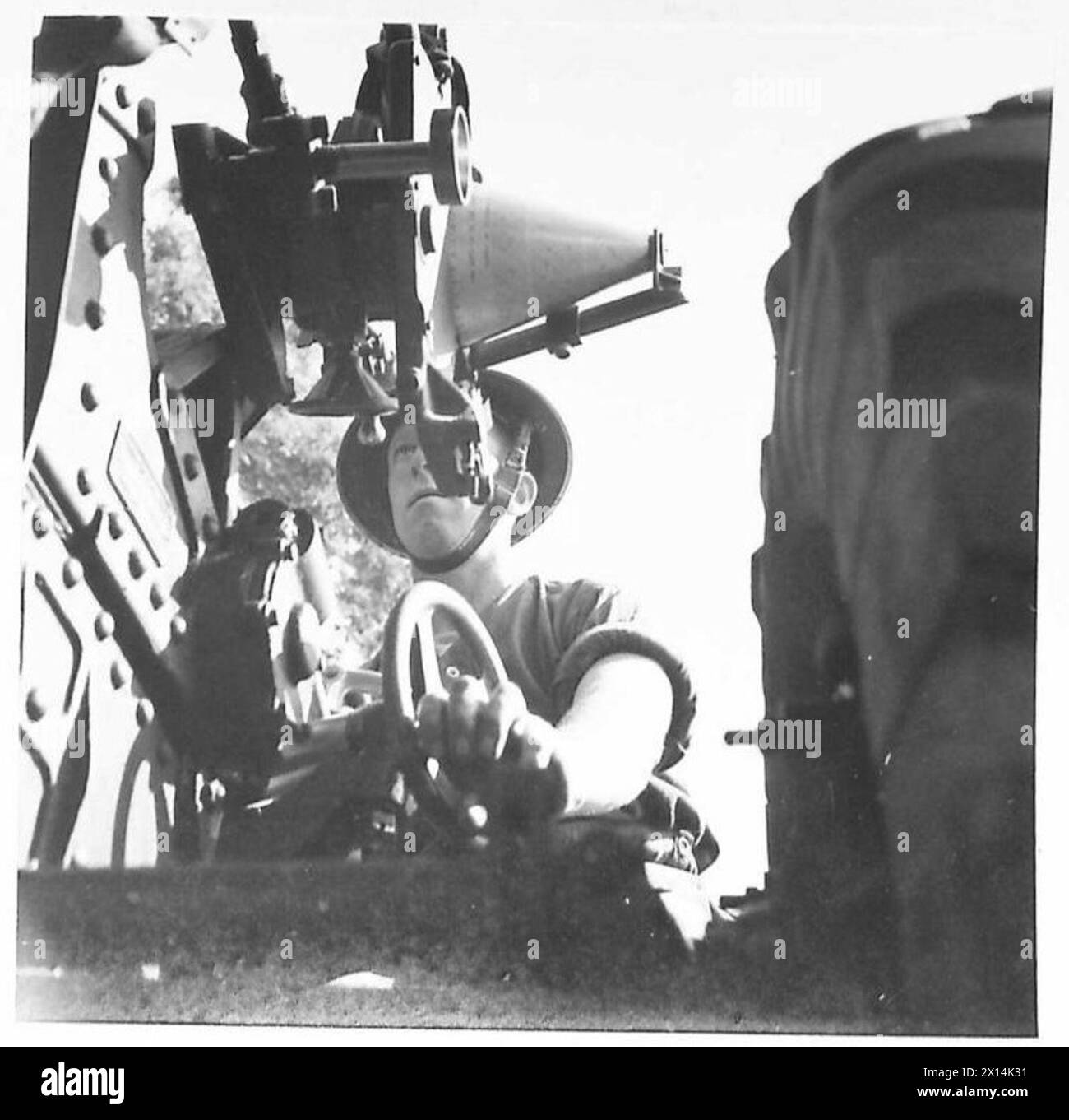 A FIELD REGIMENT OF THE ROYAL ARTILLERY - The layer, or No. 3 at the ...