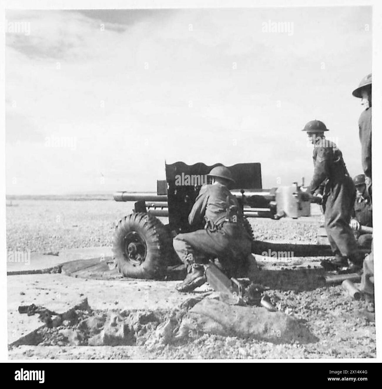 Gun crews prepare and conduct practice firing with 6-pounder anti-tank ...