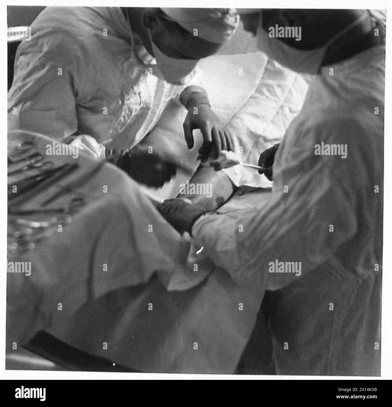Medical personnel at a casualty clearing station in North Africa remove ...