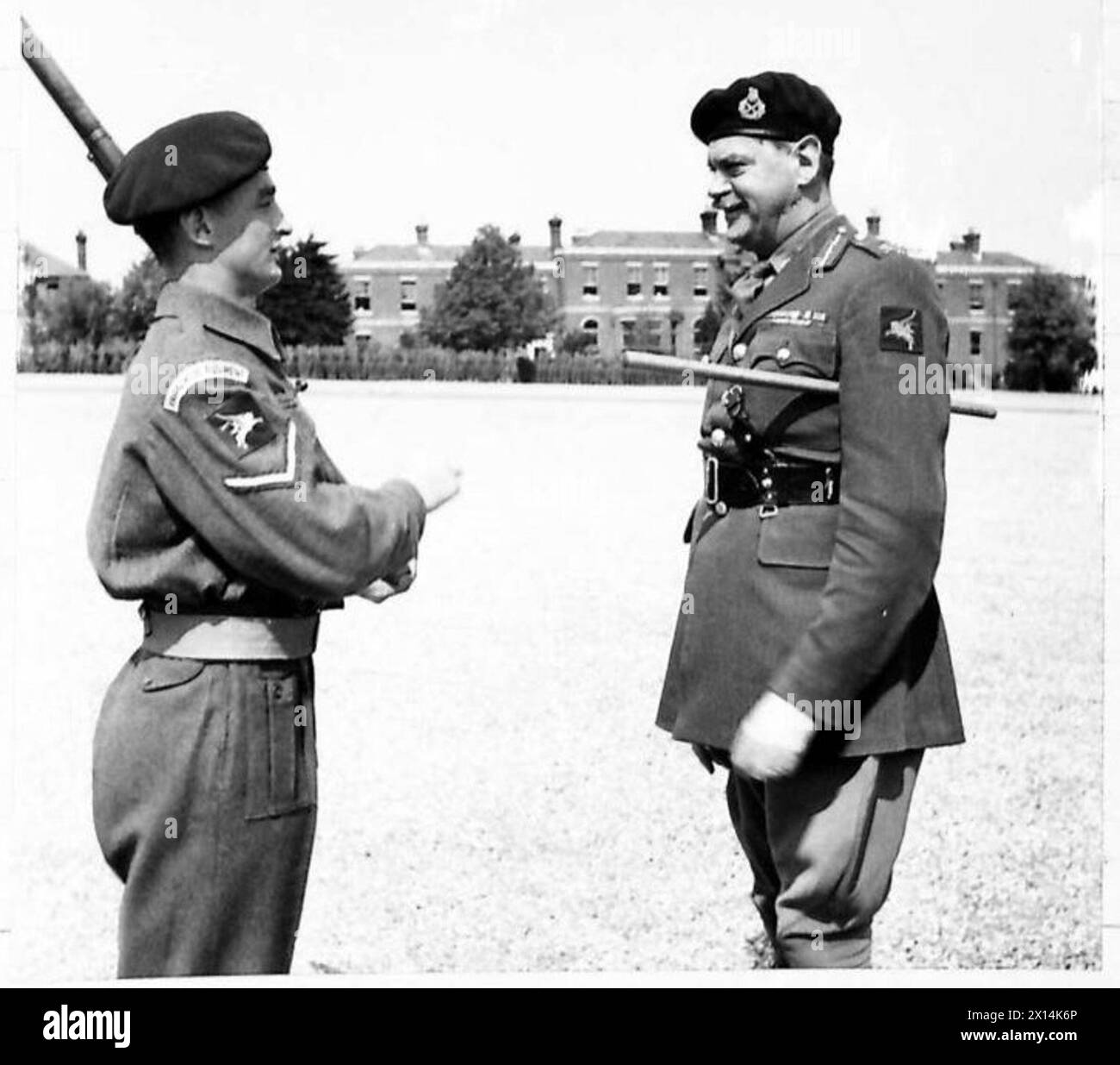 Major General Gale congratulates Lance Corporal Lyall, awarding him a ...