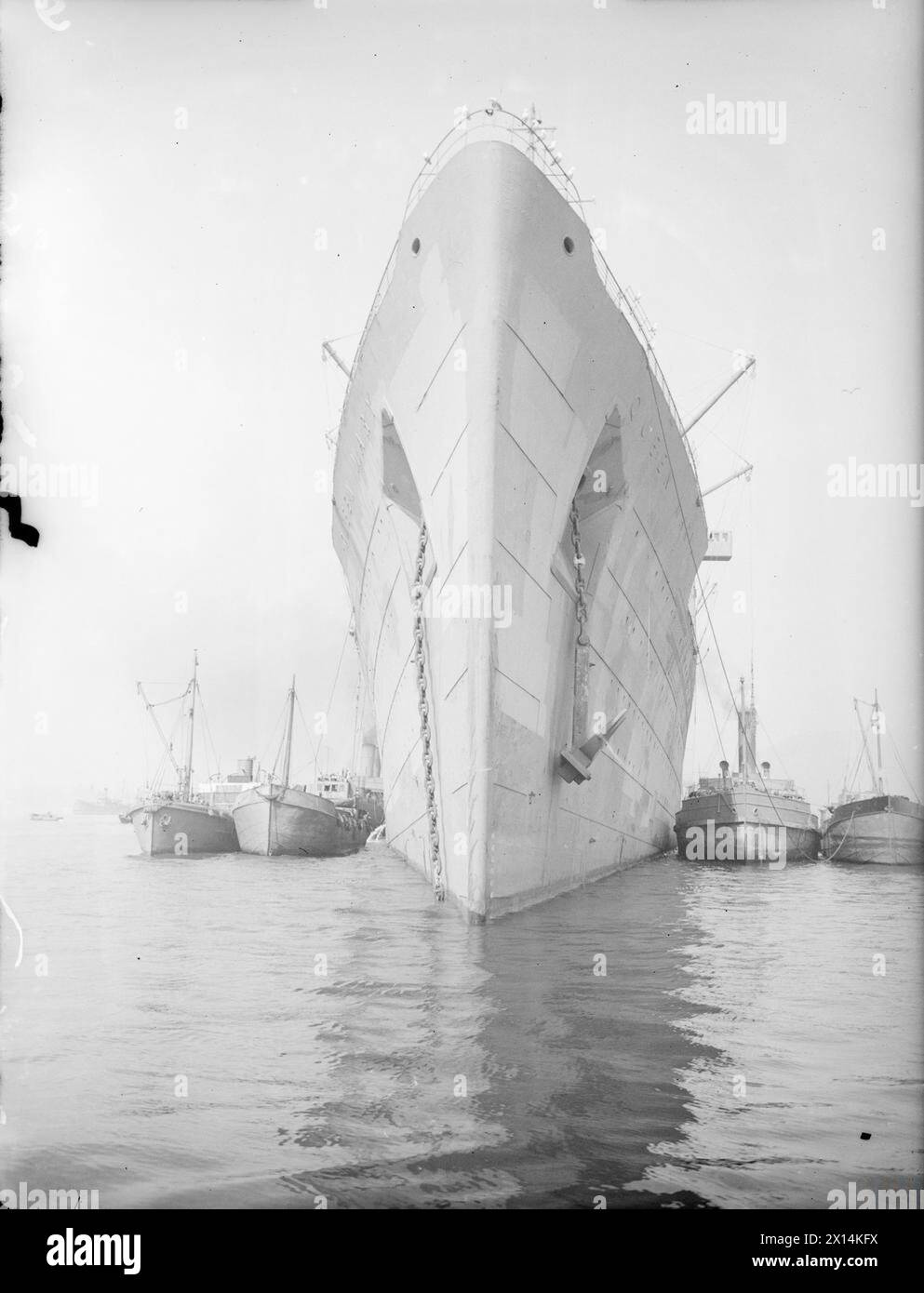 FORMER LUXURY LINER, NOW TROOPSHIP, SS QUEEN MARY AT A BRITISH PORT. 21 ...