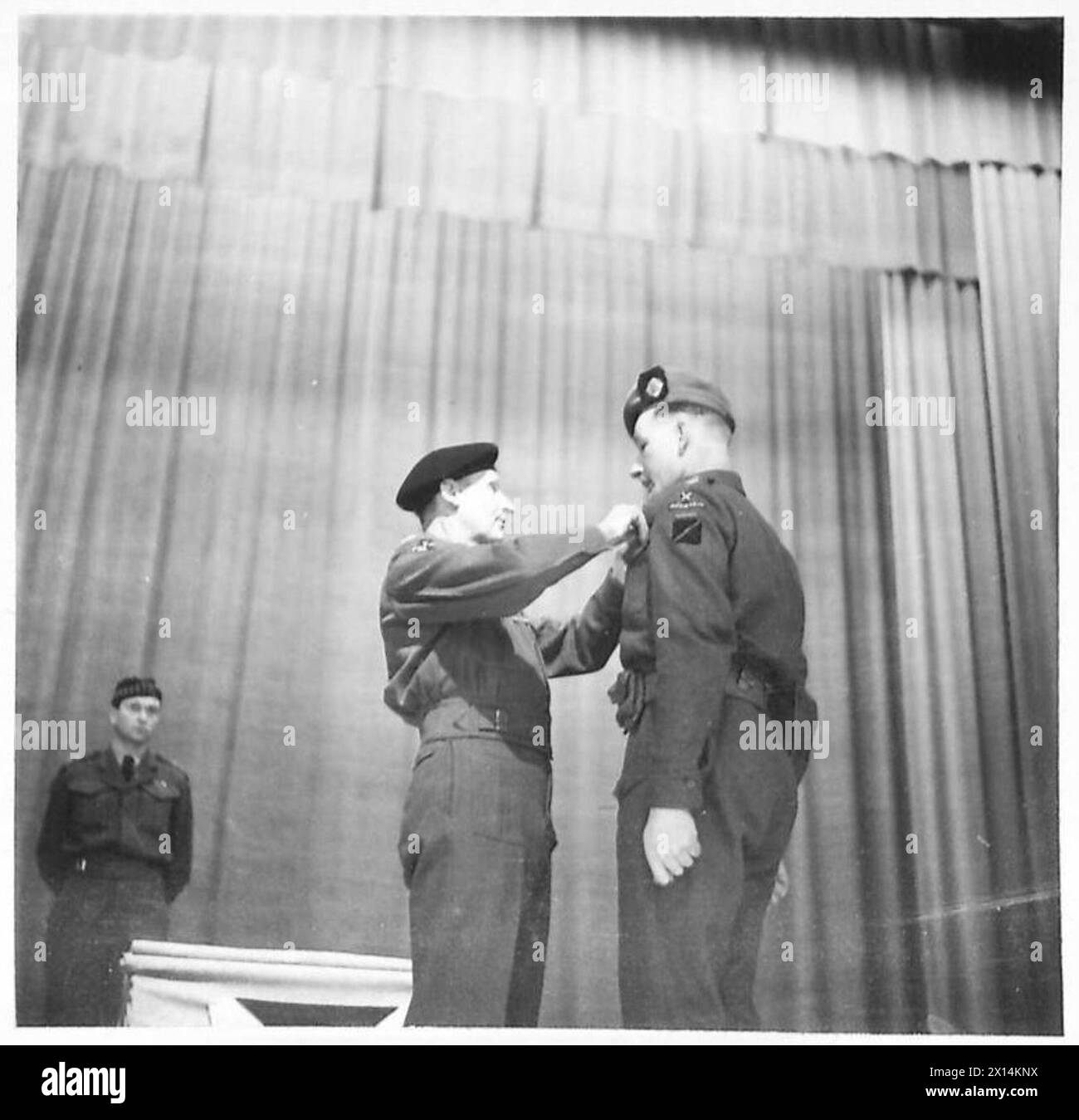 Lieutenant J. Cameron of the 7/9 Royal Scots receives the Military ...