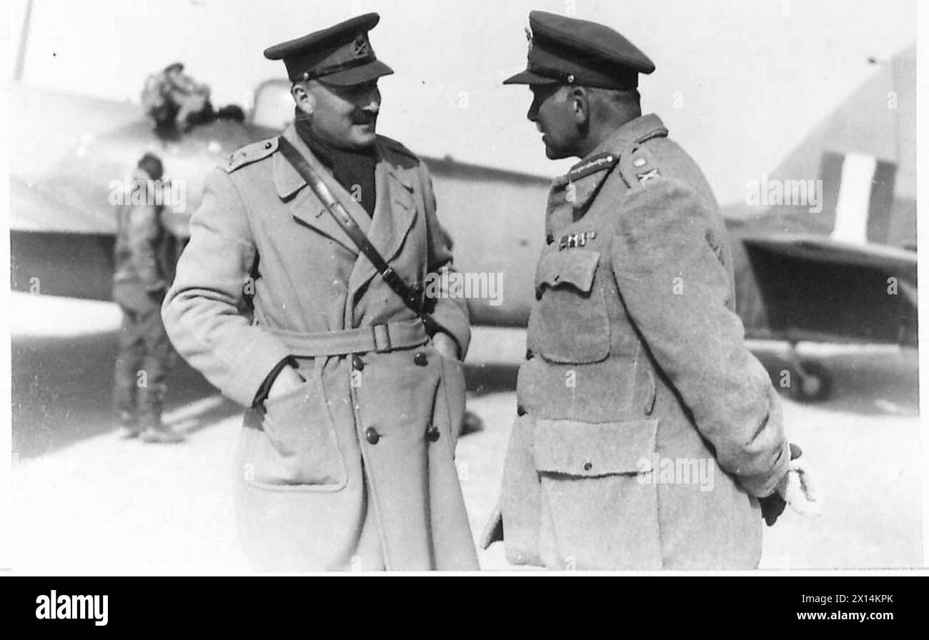 Lieut. General Ritchie is met by Lieut. General Norrie at an aerodrome ...