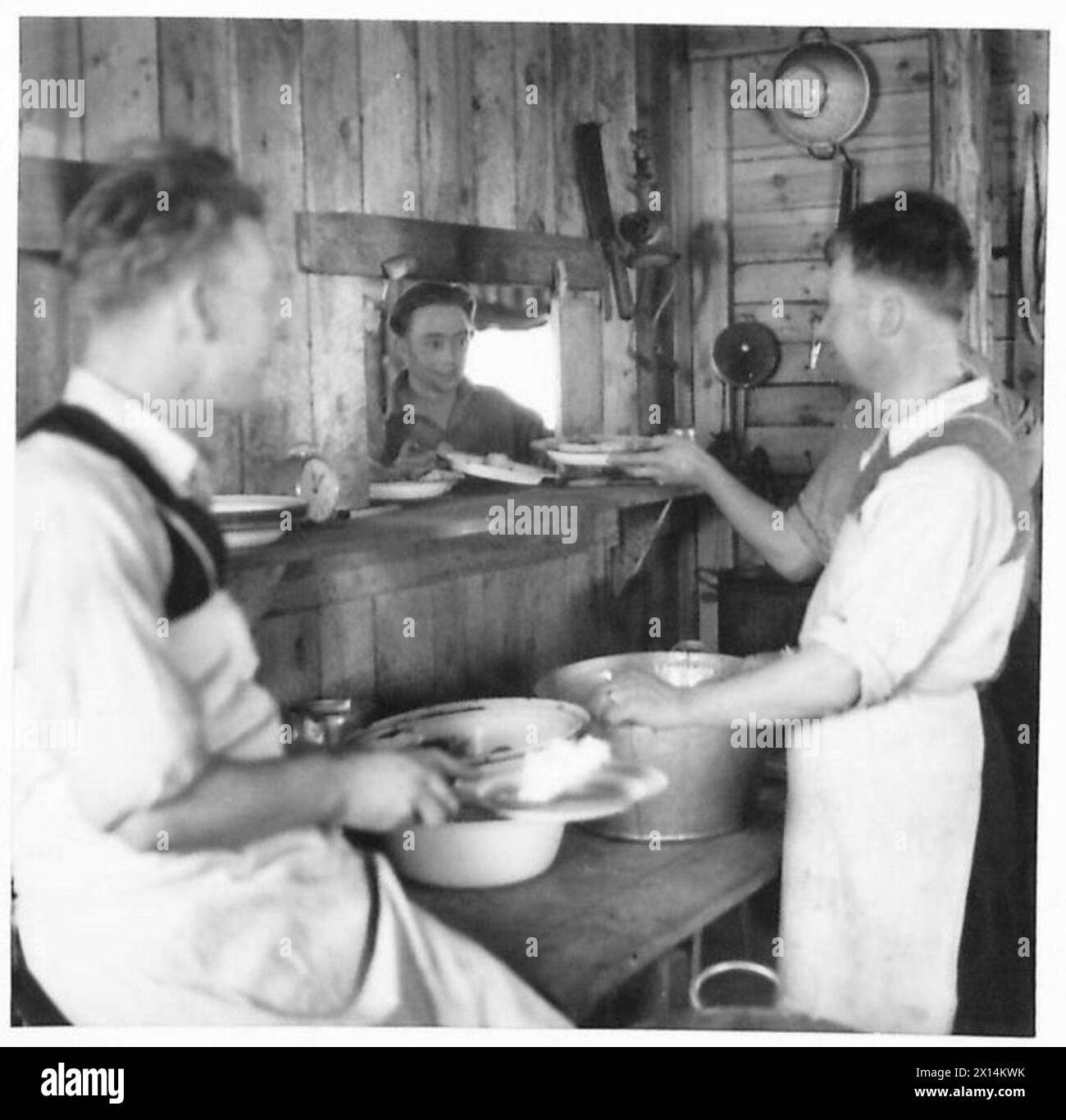 CANADIAN LOGGERS CAMP IN SCOTLAND - The cookhouse showing meals being ...