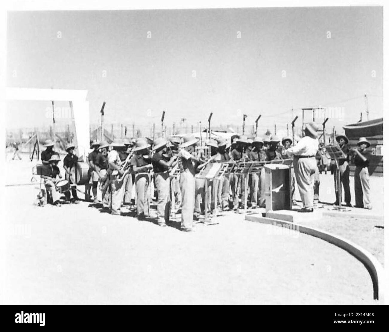 DAILY ROUTINE AT PRISONERS OF WAR CAMP IN WESTERN DESERT - These three ...