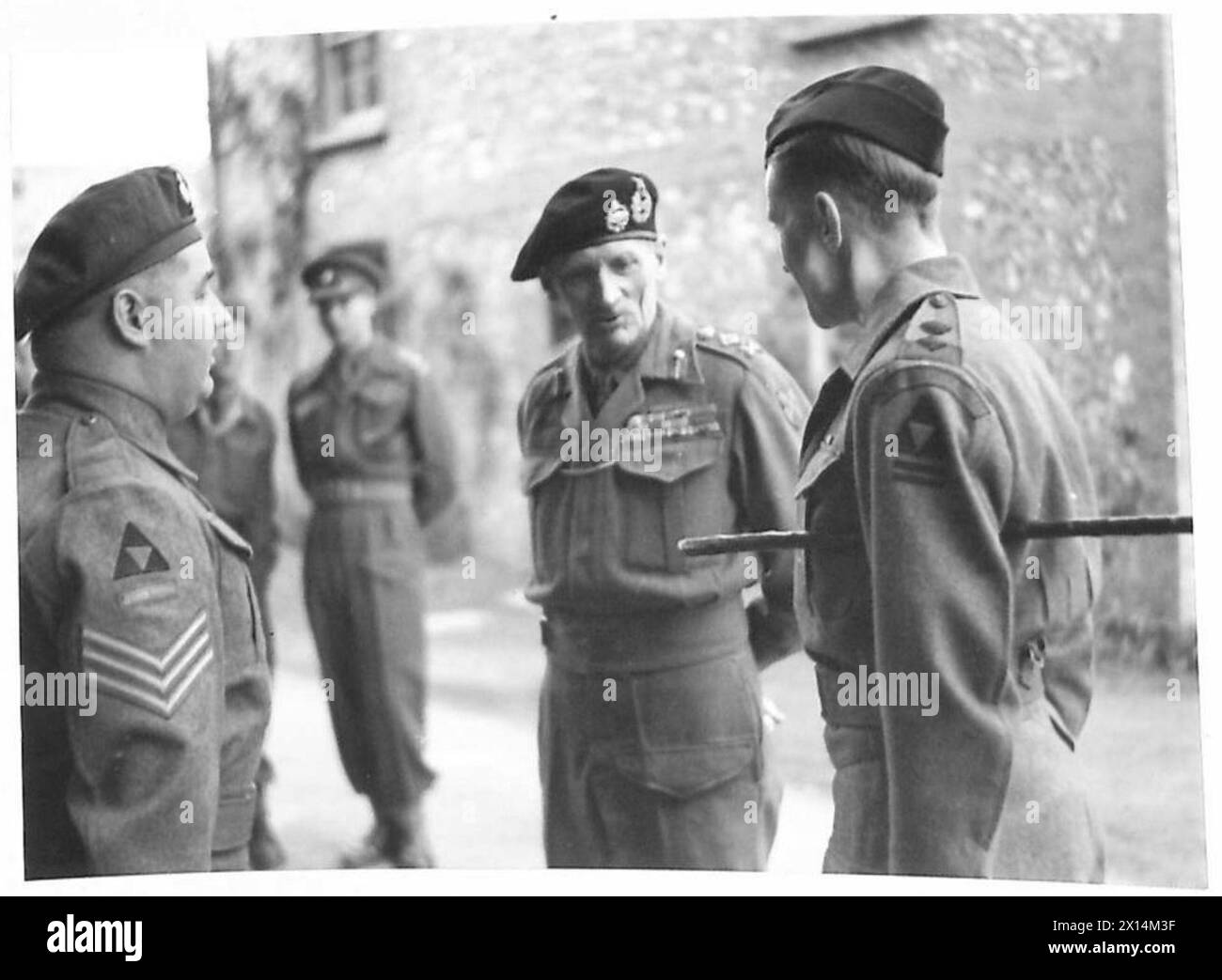 GENERAL MONTGOMERY INSPECTS ROYAL ULSTER RIFLES - General Montgomery talking to Sergeant Cook ...