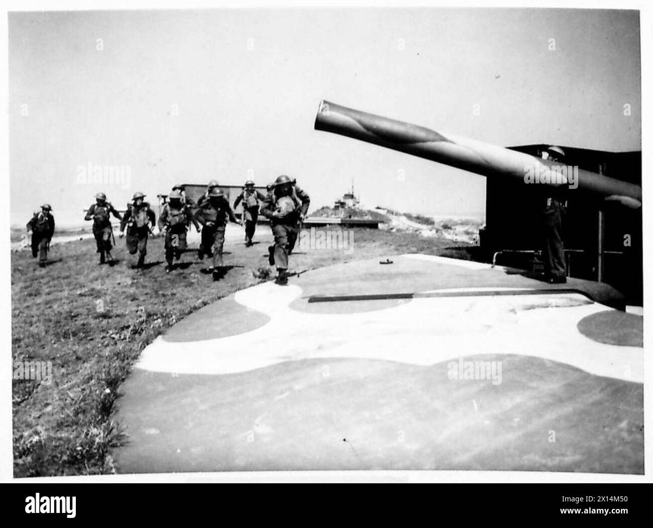 BRITAIN S DEFENCES - "Action Stations". The gun crews double to their ...