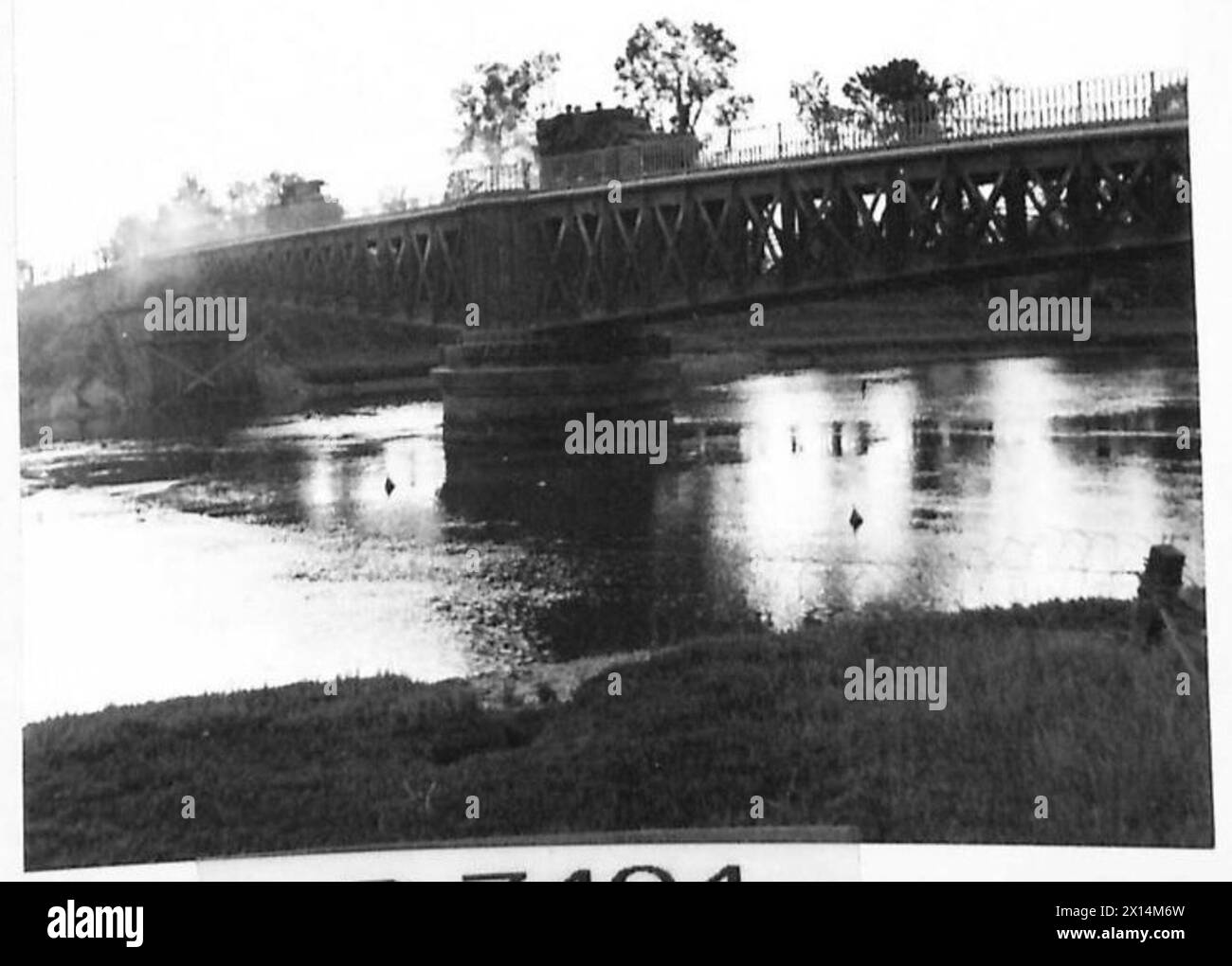 OUR ARMOUR CROSSES THE ORNE BRIDGE - Vehicles make their way across the ...