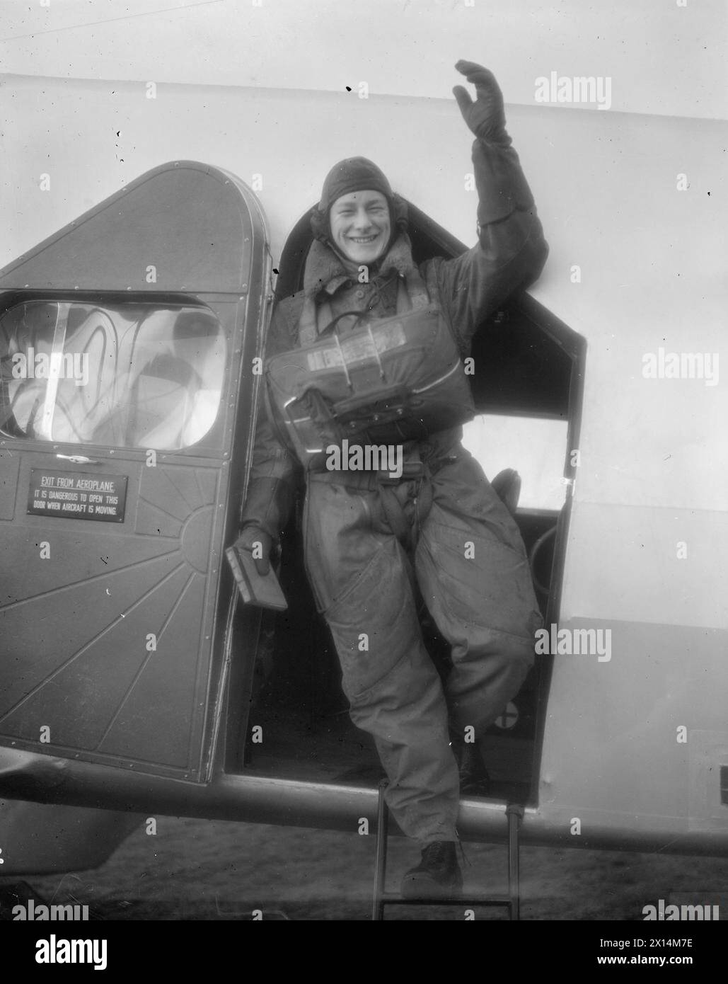 MAN ALIGHTING FROM RAF AIRCRAFT. (1930'S-1940'S). - Man wearing flight ...