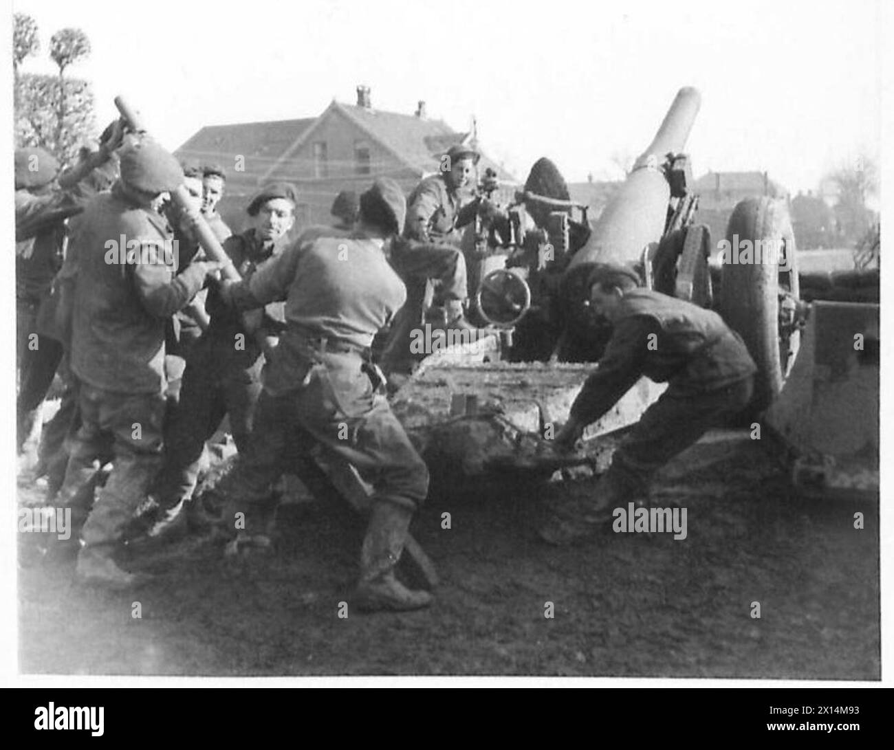 Photograph showing a 7.2-inch gun and its crew firing at a range of ...
