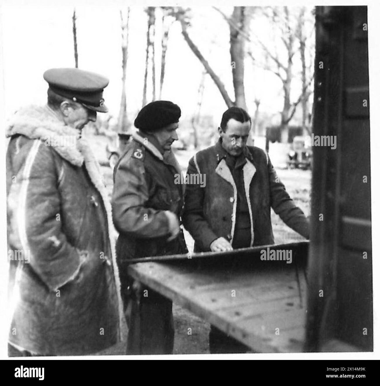 Lt-Gen Horrocks, Commander-in-Chief, studies a front-line map with Gen ...