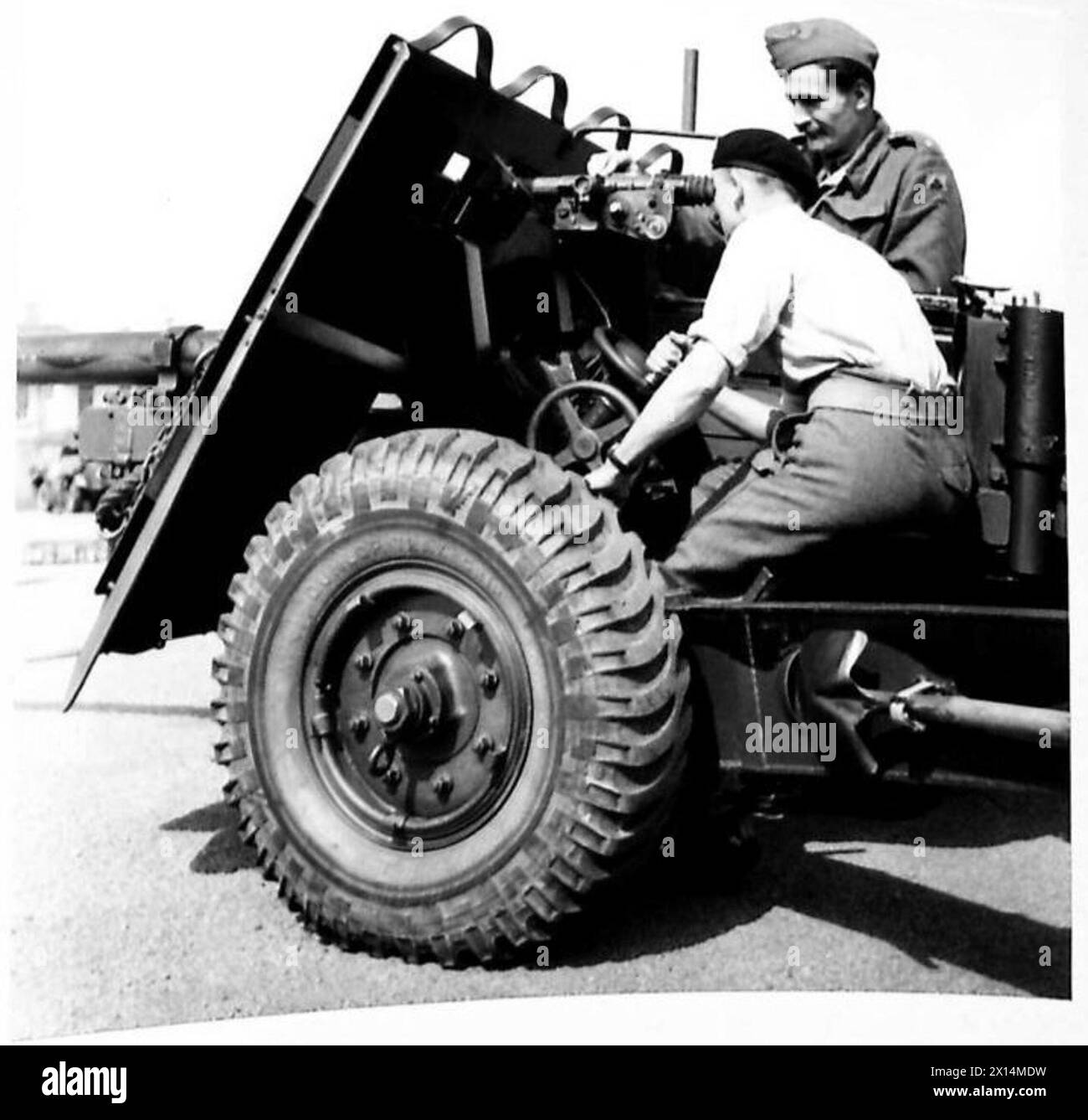 The Commanding Officer of a Royal Tank Regiment battalion examines the ...