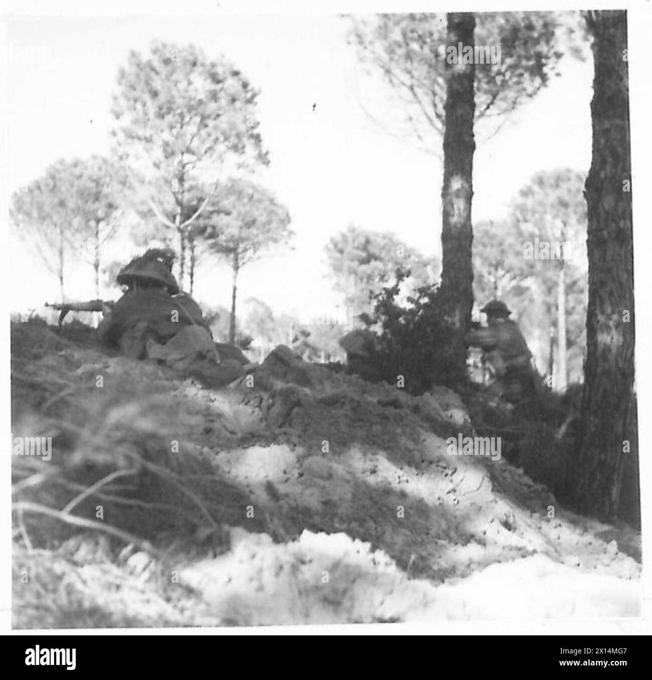 EIGHTH ARMY - From the cover of a mount of earth, infantry watch for ...