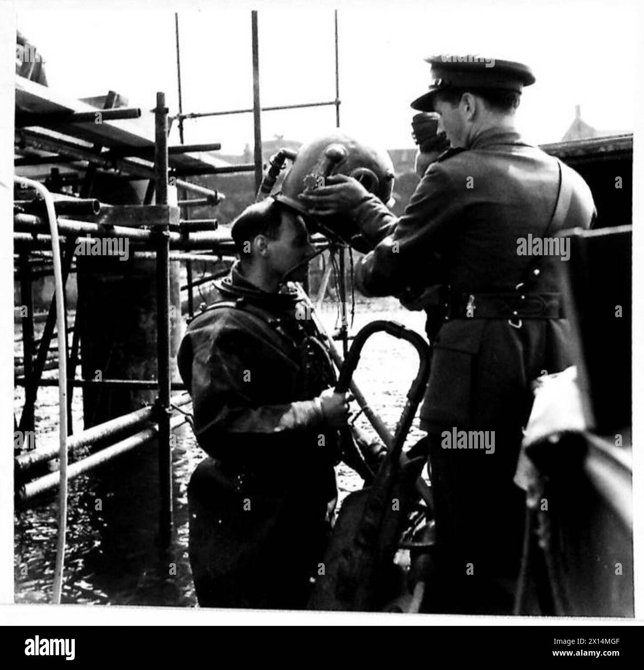 A BBC war correspondent records underwater using a helmet-mounted ...