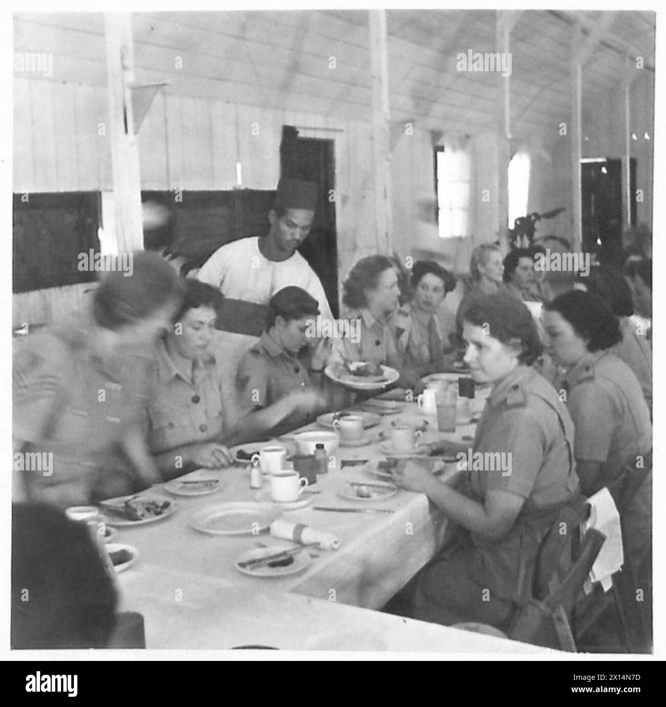 WOMEN'S ARMY AUXILLIARY SERVICES IN DESERT CAMP - The large mess room ...
