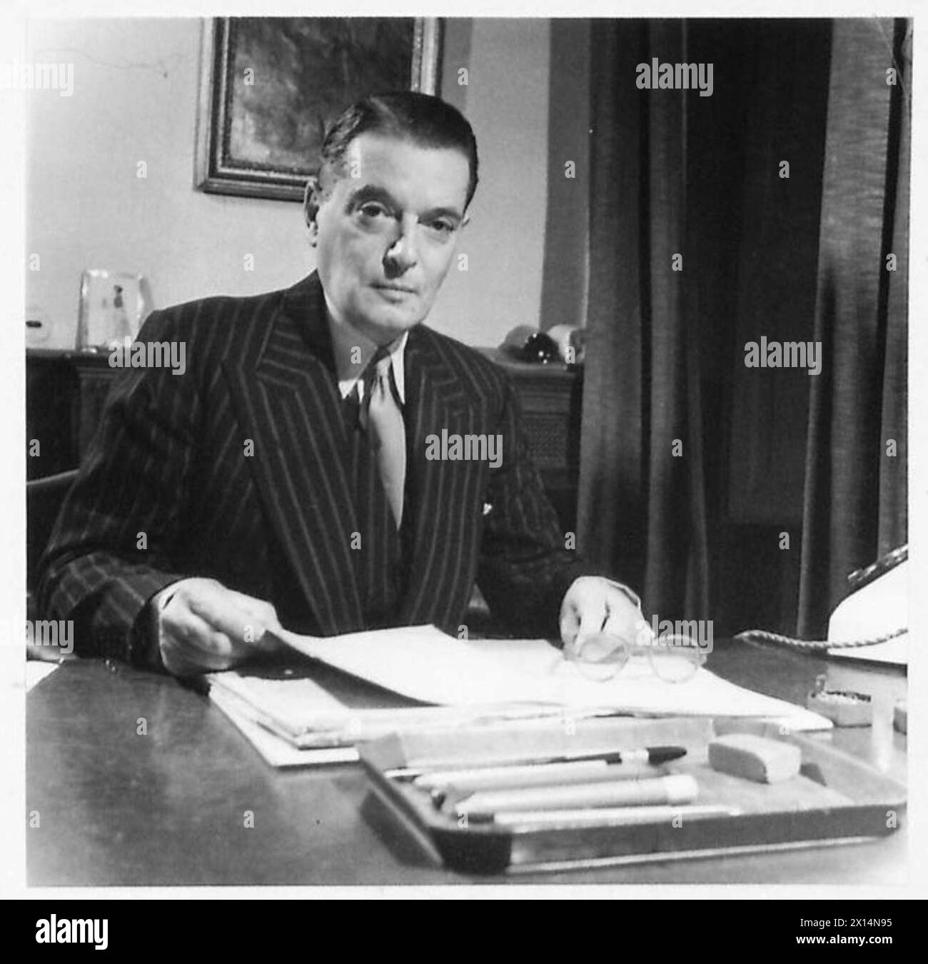 Sir Noel Charles is photographed in his office at the British Embassy ...