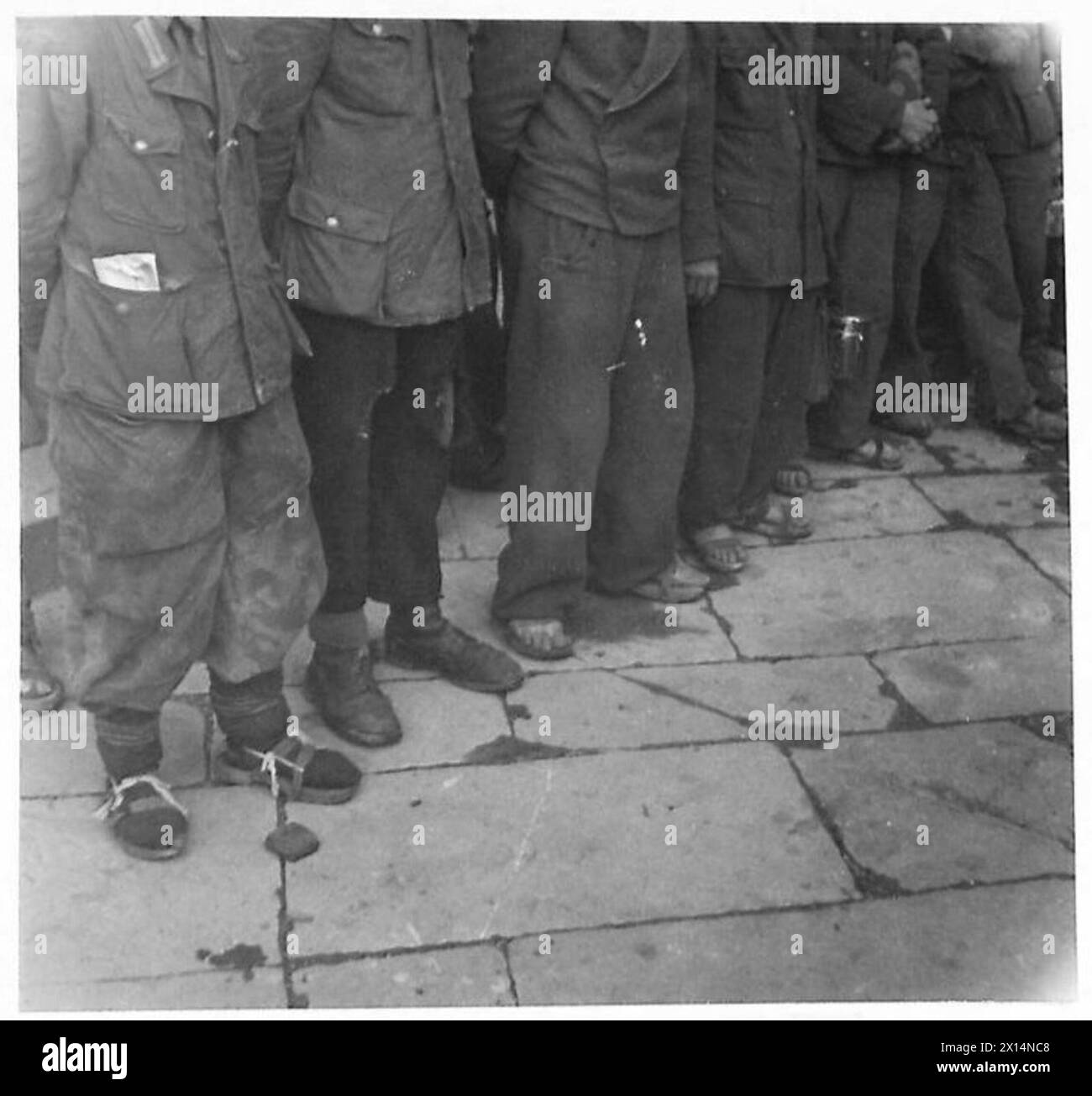 Partisans capture German prisoners wearing sandals during Eighth Army ...