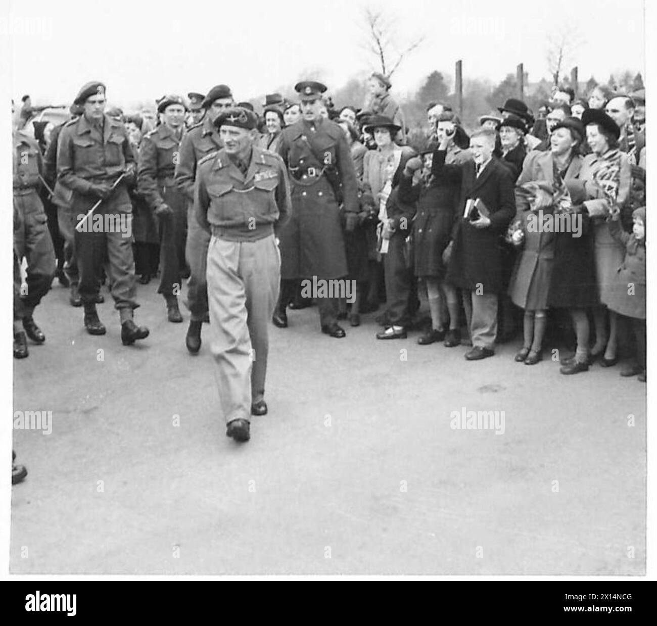 General Montgomery walks through crowded streets inspecting Allied ...