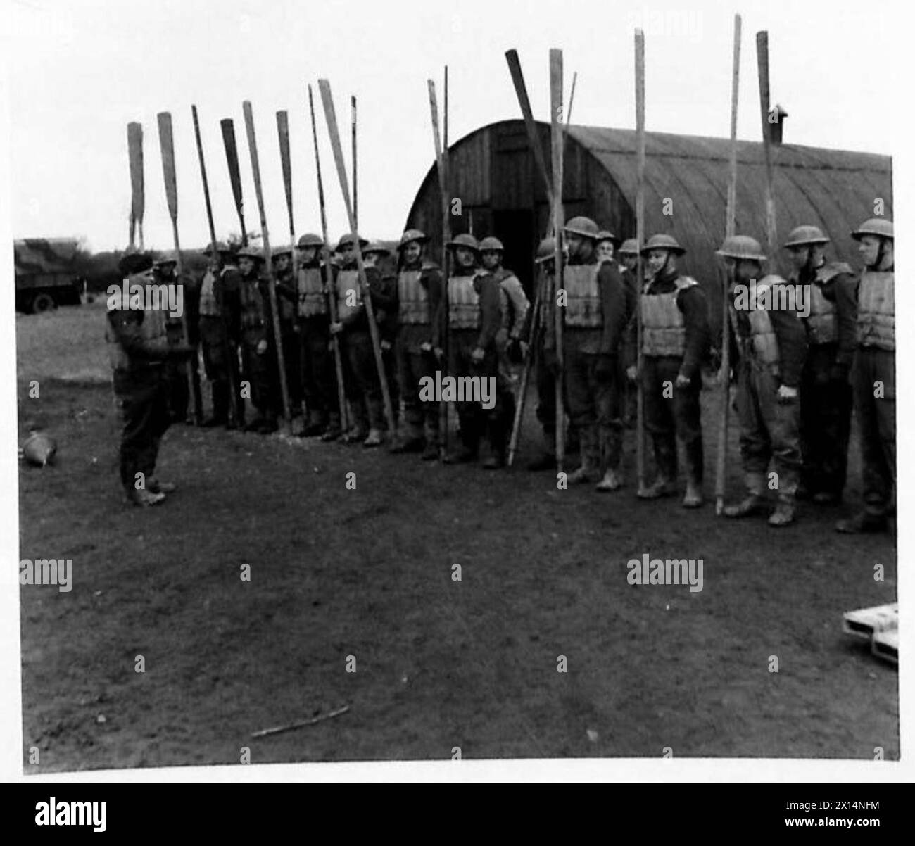 THE ARMY TAKES TO THE WATER - The men lined up with oars and life ...