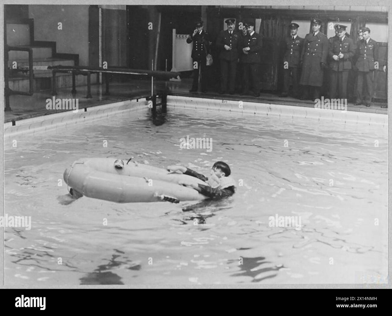 An RAF airman embarks in a dinghy equipped with a new life jacket ...