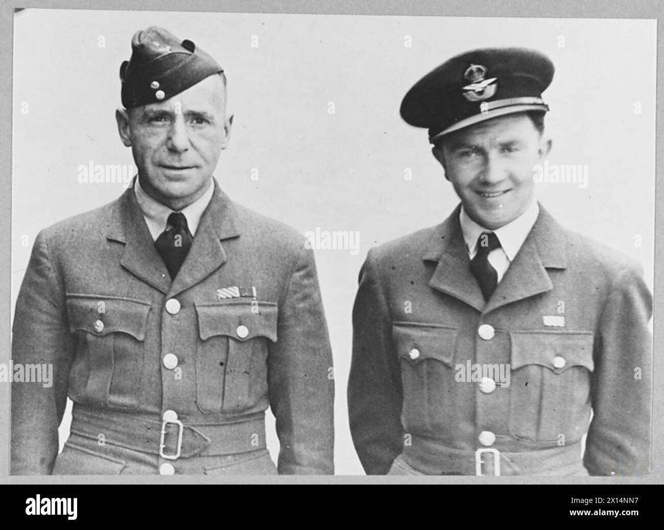 R.A.F. "BIRD MEN" AWARDED A.F.C. - Flight Lieutenant H.W. Ward [left ...