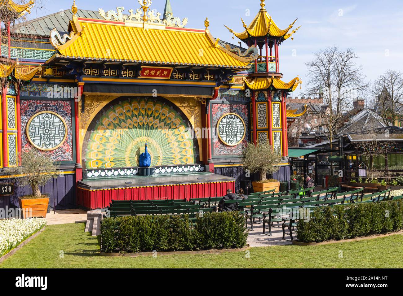Chinese-style pantomime theatre with large peacock and empty theater ...