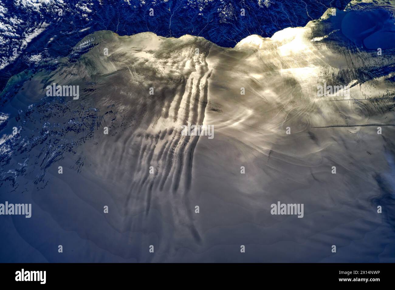 Sunlight reflection in the Pacific Ocean. Digital enhancement of an ...