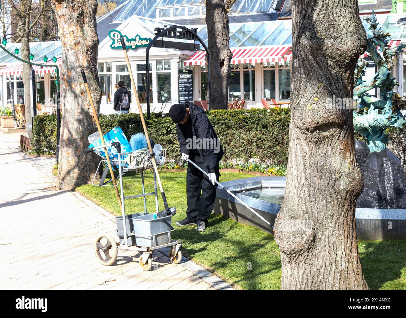 Janitor sweeping footpath on street hi-res stock photography and images ...