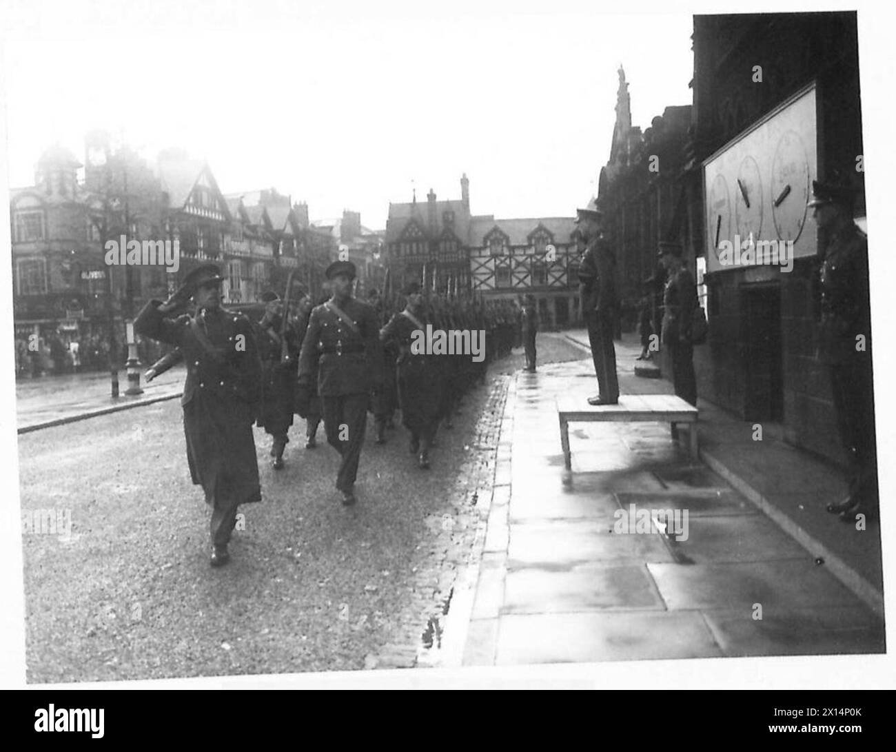 General Sir Robert Gordon-Finlayson salutes troops and A.T.S. members ...