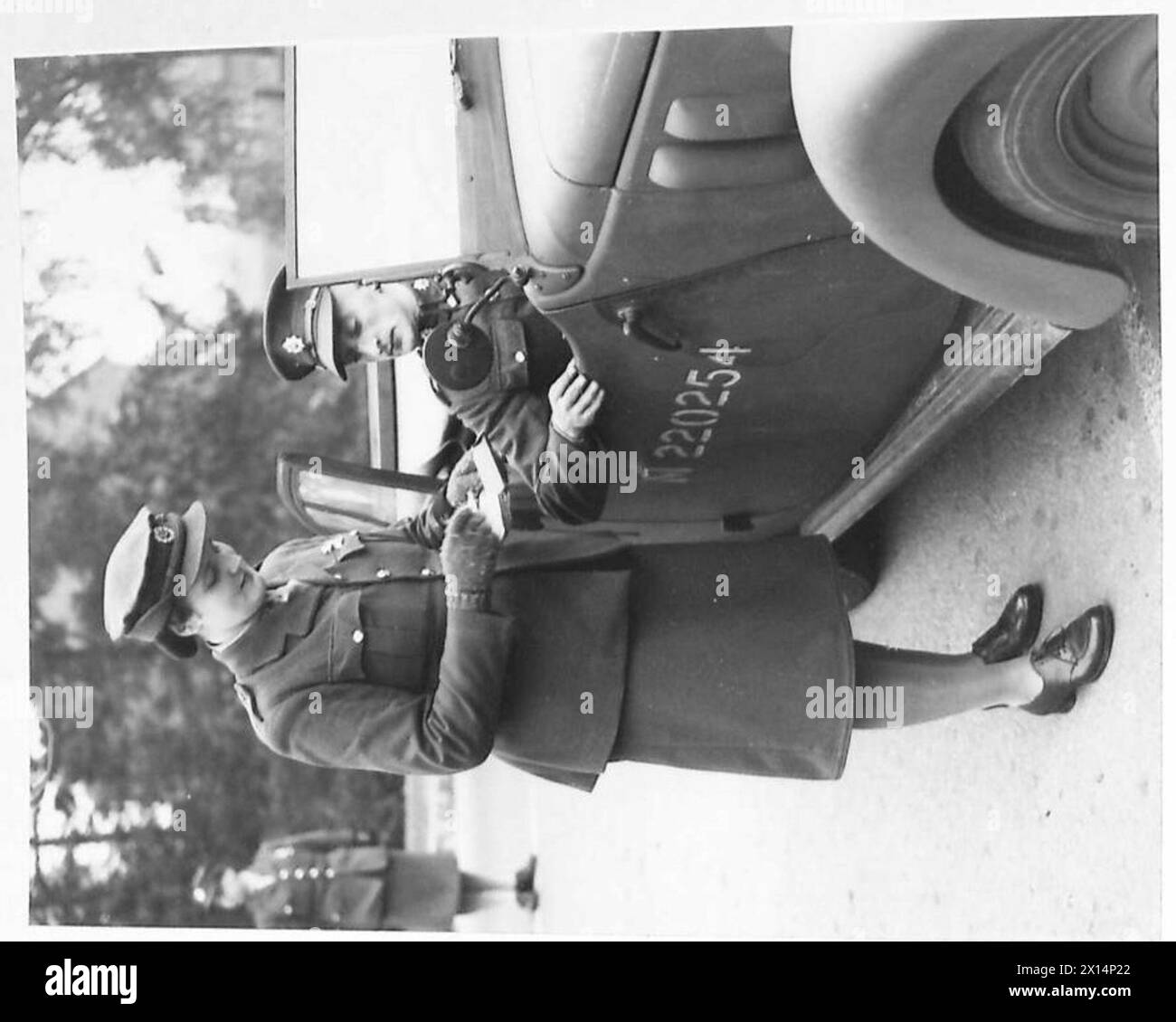 AT AN A.T.S. TRAINING CENTRE - An R.P. (ATS Regimental Police) checking ...