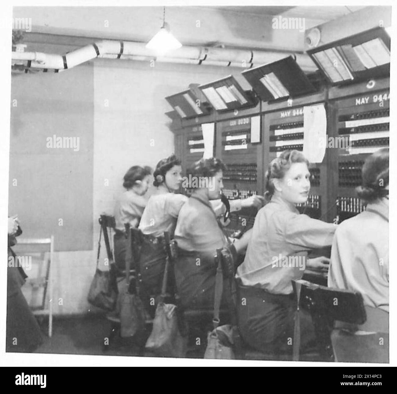 ATS operators at work on a telephone switchboard during an exhibition ...