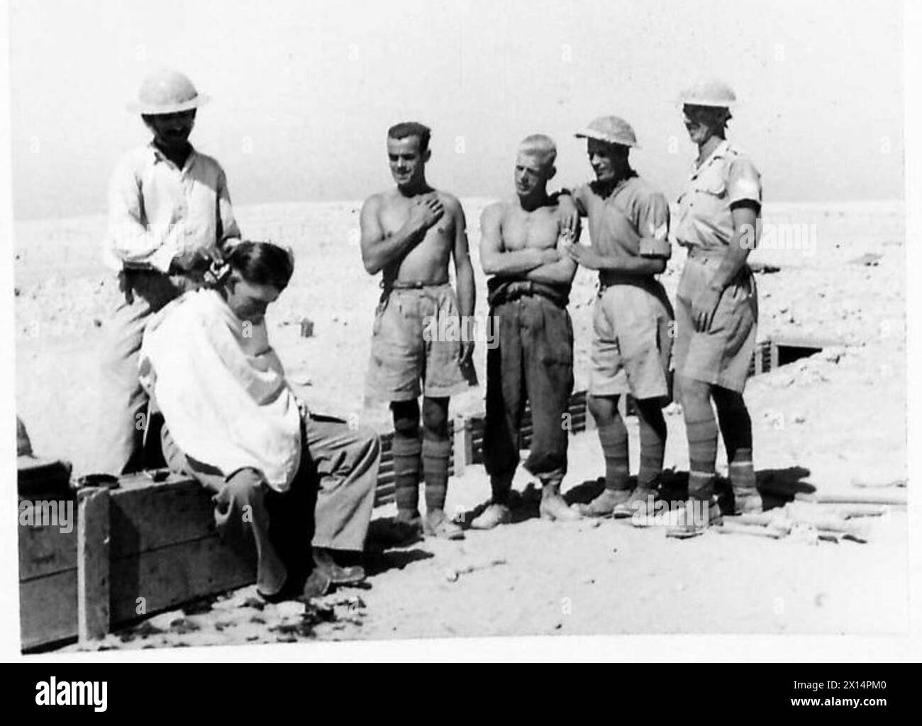 British soldiers in the Western Desert queue for haircuts, captured in ...