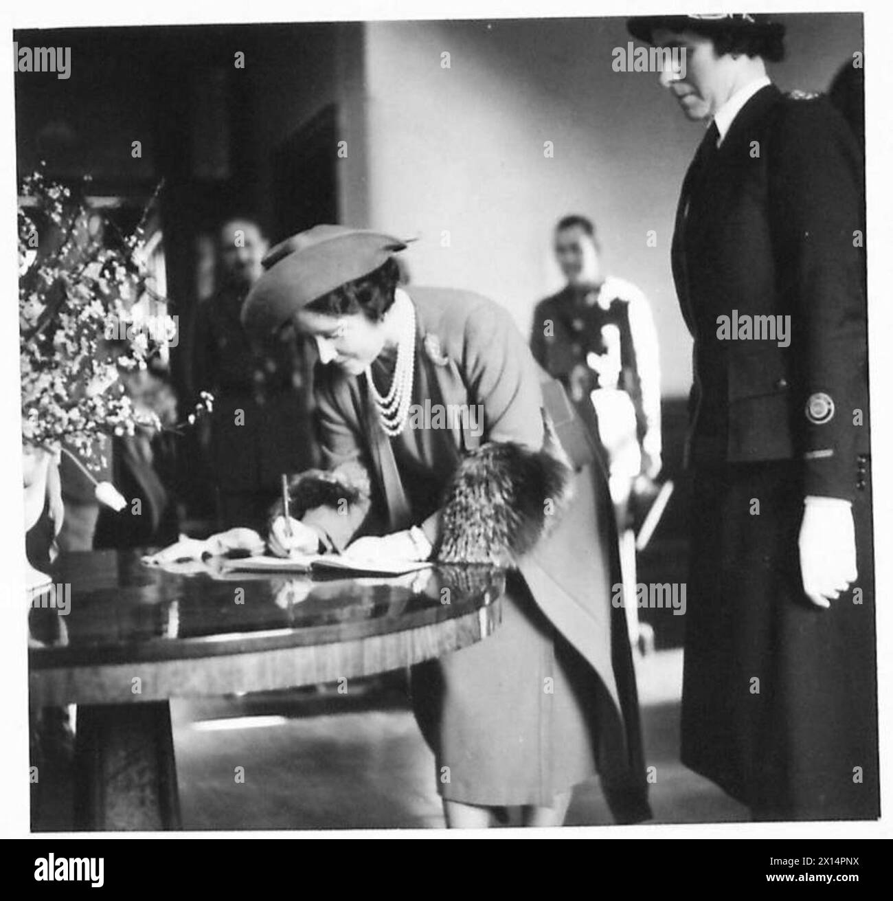 Queen signs visitors book Cut Out Stock Images & Pictures - Alamy