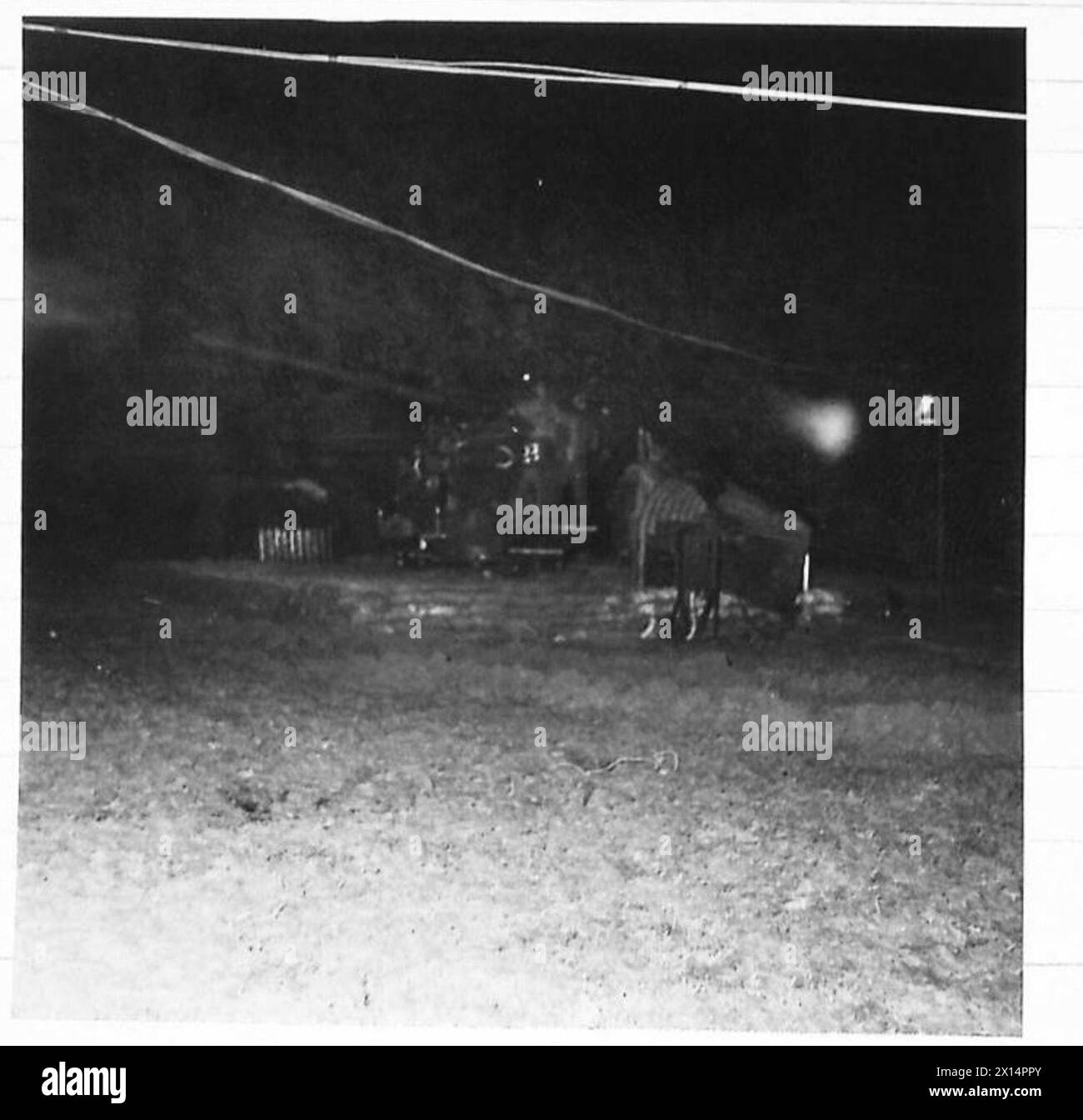 ANTI-AIRCRAFT GUNS IN ACTION AT NIGHT - Searchlights follow the course ...