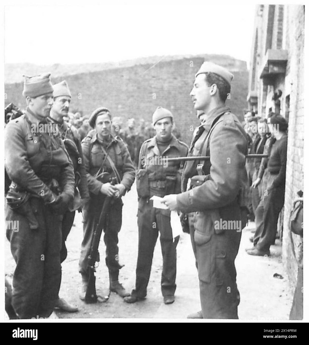 RAID ON FRENCH COAST - Major Lord Lovat giving orders to officers ...